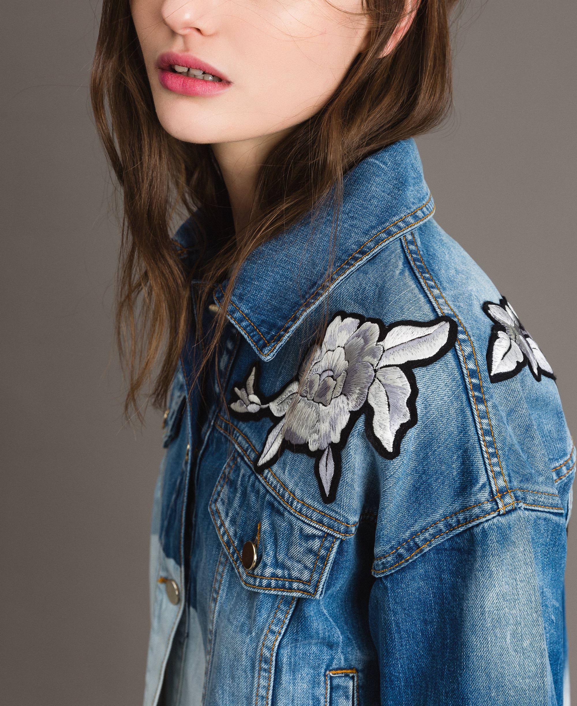Denim jacket with floral patch